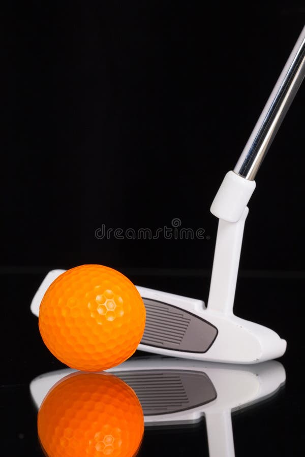 Golf Putter and Gold Equipments on the Black Glass Desk Stock Image ...