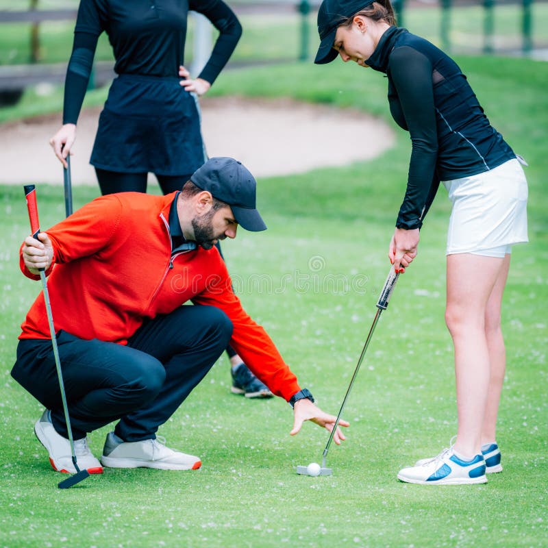 Golf Putting Lesson, Two Young Female Golfers Practicing Putting with ...