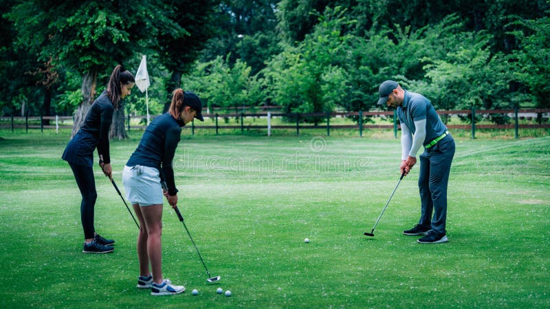 Golf Putting. Two Young Ladies Practicing Putting Stock Photo - Image ...