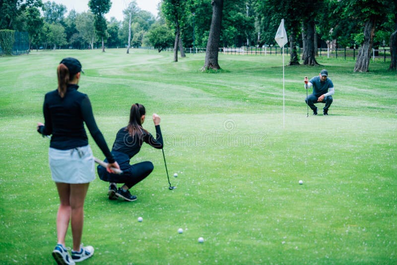 Golf Putting. Two Young Ladies Practicing Putting Stock Photo - Image ...