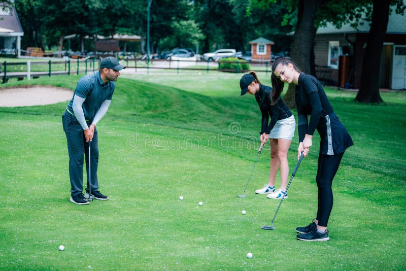 Golf Putting. Two Young Ladies Practicing Putting Stock Photo - Image ...
