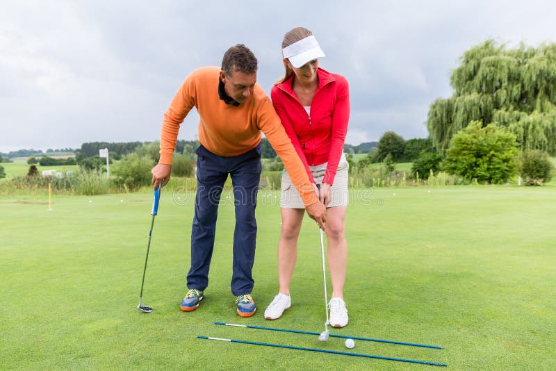 Golf Trainer Helping the Female Player Stock Photo - Image of casual ...