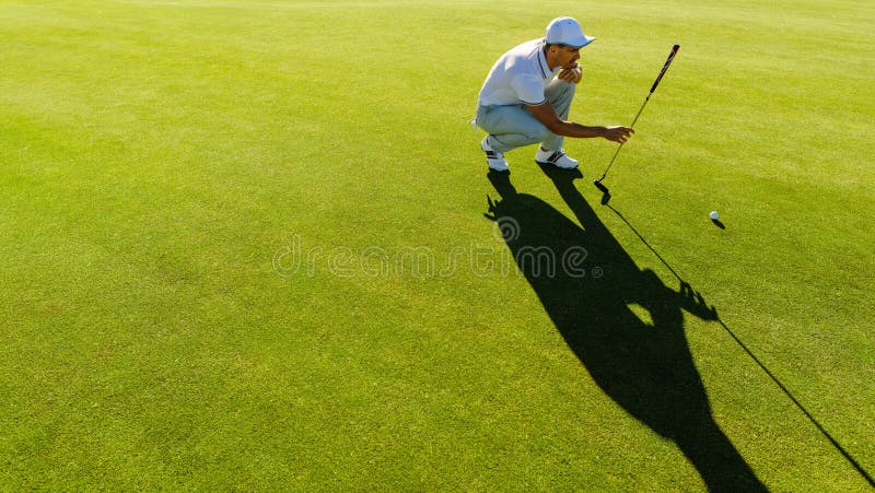 Golfer Checking Line for Putting Golf Ball Stock Image - Image of ...