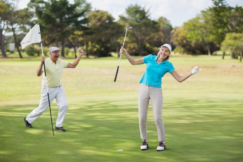 Golfer Couple Celebrating Success Stock Image - Image of activity, ball ...