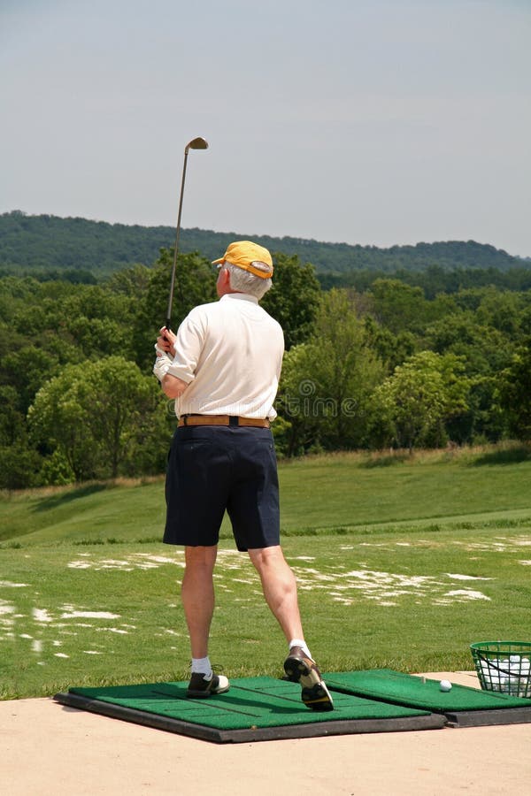 Golfer at Driving Range stock photo. Image of leisure - 1261130