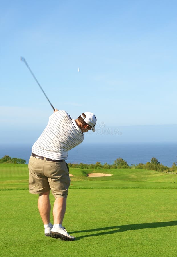 Golfer Hitting a Golf Ball from a Back View. Editorial Photography ...