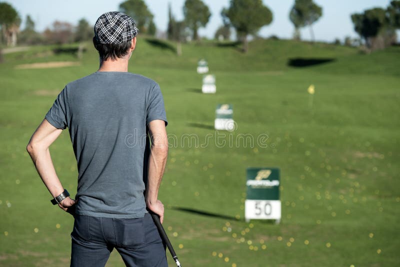 Golfer on His Back Leaning on a Golf Club Looking at the Horizon Stock ...