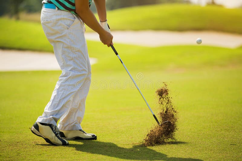 Golfer Hitting Ball with Force. the Grass Distribution the Blur of Golf ...