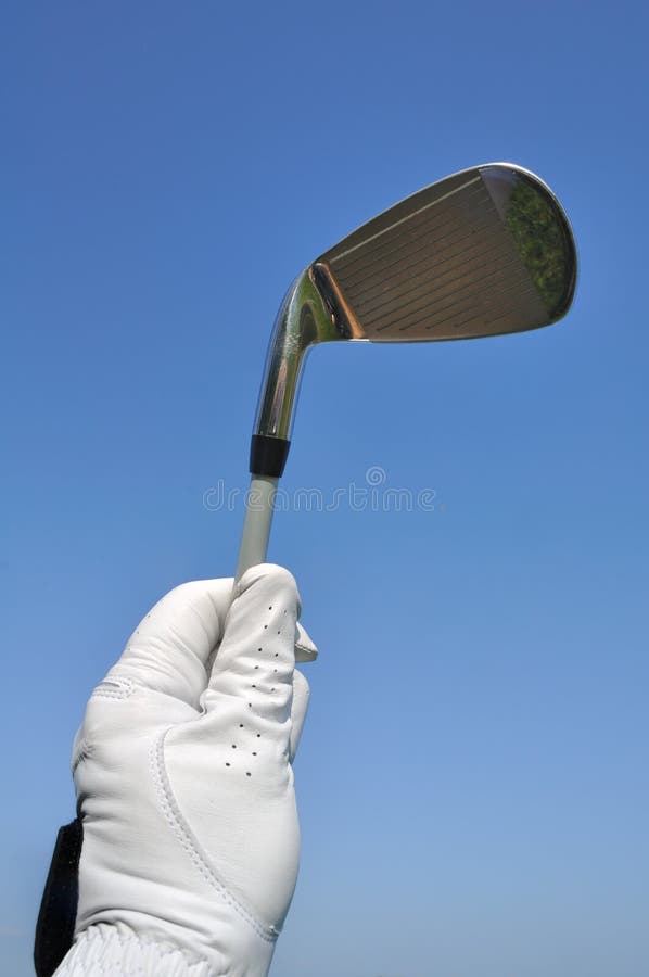 Golfer Holding an Iron (Golf Club) Stock Photo - Image of hold, golfing ...
