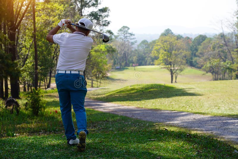 Golfer Playing Golf in the Evening Golf Course, on Sun Set Evening Time ...