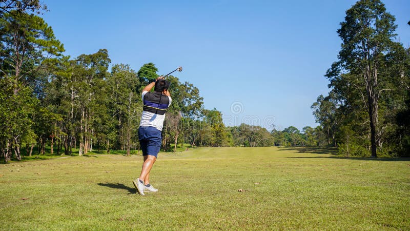 Golfer Playing Golf in the Evening Golf Course, on Sun Set Evening Time ...