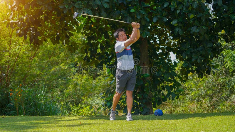 Golfer Playing Golf in the Evening Golf Course, on Sun Set Evening Time ...