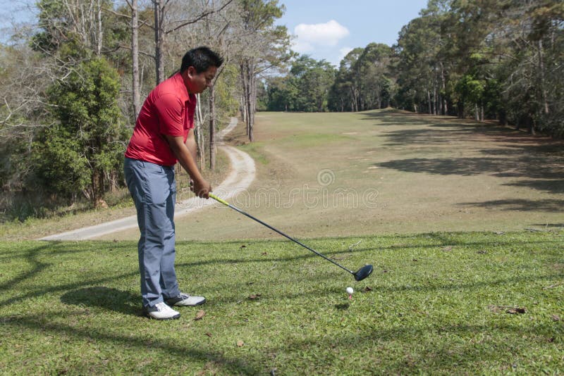 Golfer Playing Golf in the Evening Golf Course, on Sun Set Evening Time ...