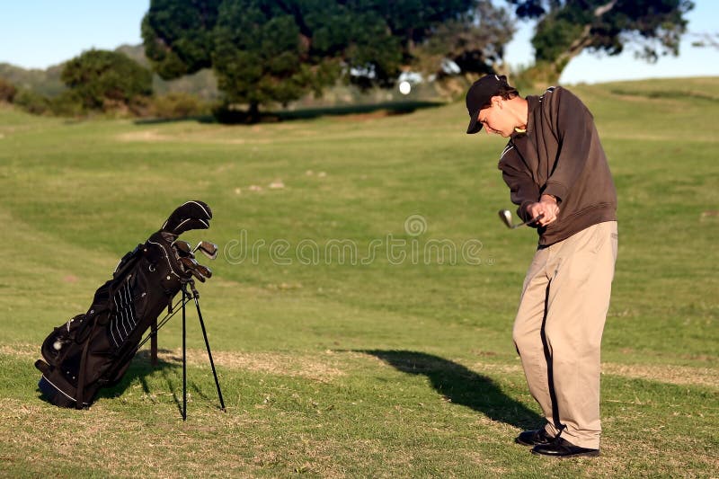 Golfer playing lob shot stock photo. Image of golf, business - 3187128