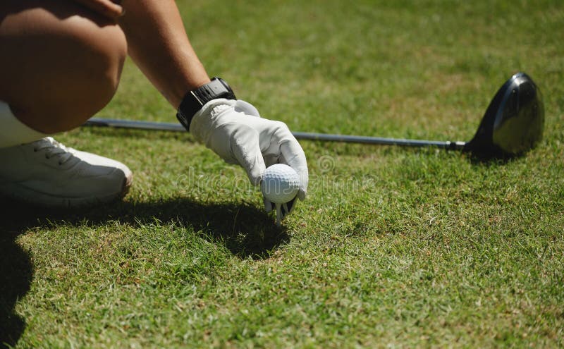 A Golfer Prepares To Take a Swing on a Sunny Day with a Focus on the ...
