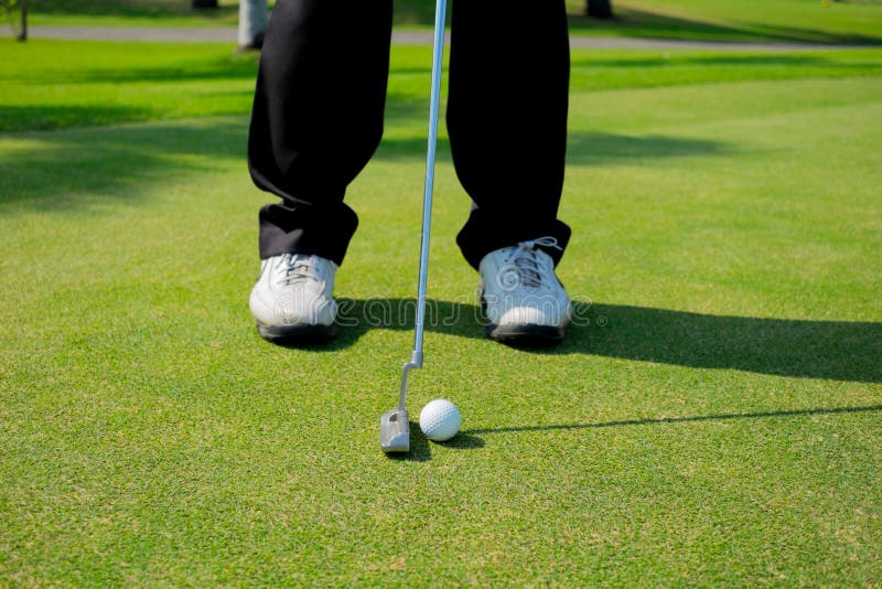 Golfer putting golf ball stock photo. Image of putting - 66680204