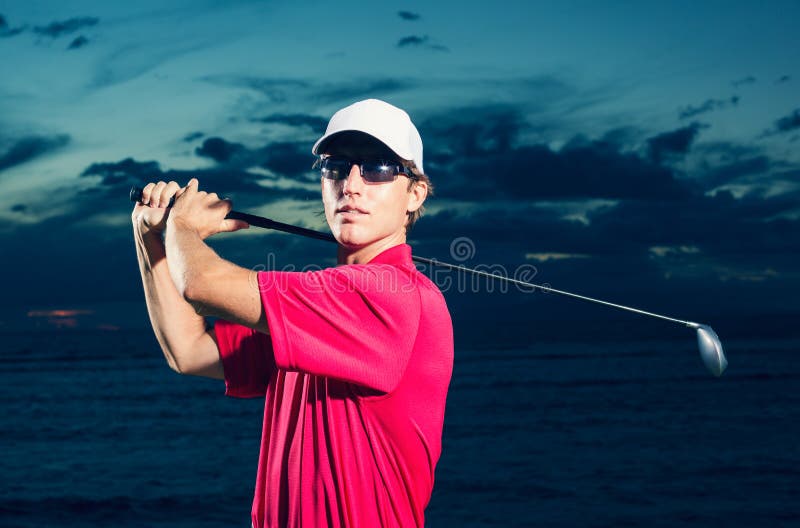 Golfer at sunset stock photo. Image of outdoor, iron - 34957882