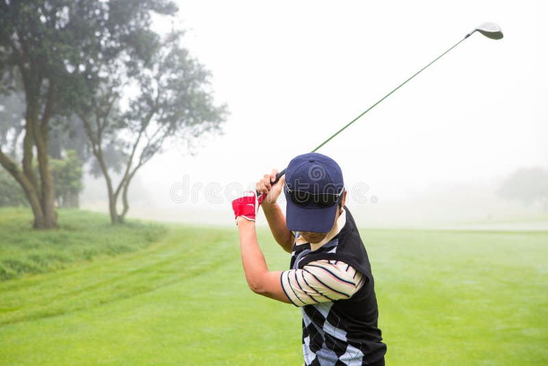 Golfer teeing off stock image. Image of adult, focused - 50486263