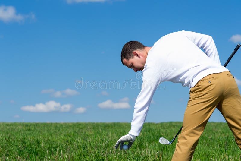 The golfer throws a ball stock photo. Image of background - 77071624