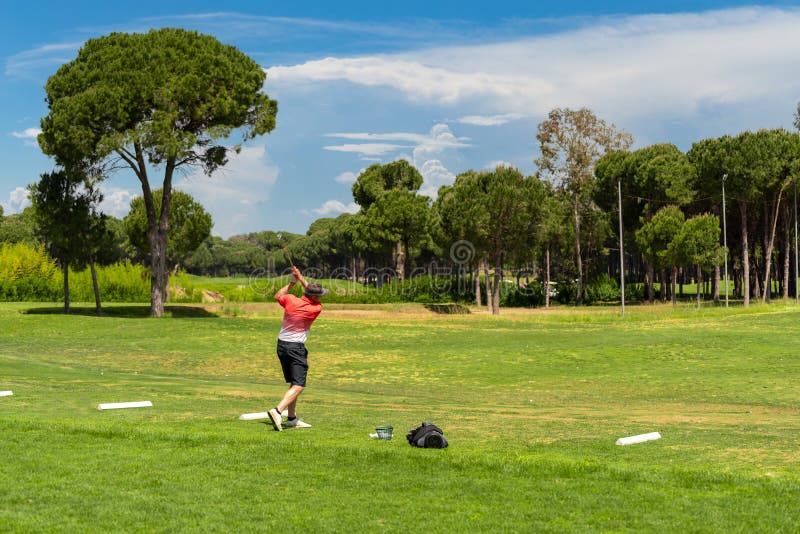 Golfer Training His Swing on Golf Driving Range Editorial Image - Image ...