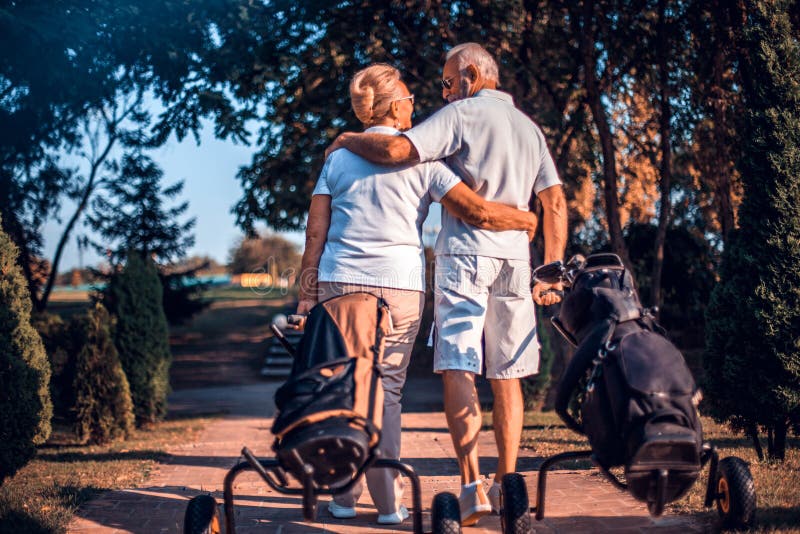 Golfers on Golf Course in Hug Stock Image - Image of female, adult ...