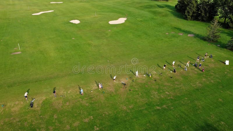 Golfers Practicing at Driving Range on Green Field. Aerial View of a ...