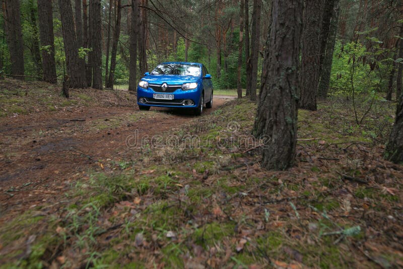 GOMEL, BELARUS - 24 MAY 2017: RENO LOGAN Blue Car Parked in a Dark Pine ...