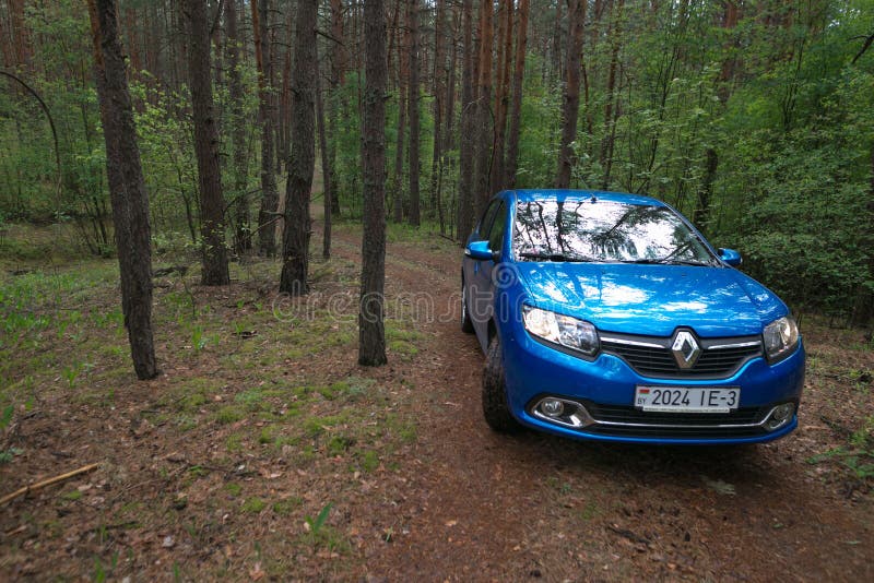 GOMEL, BELARUS - 24 MAY 2017: RENO LOGAN Blue Car Parked in a Dark Pine ...