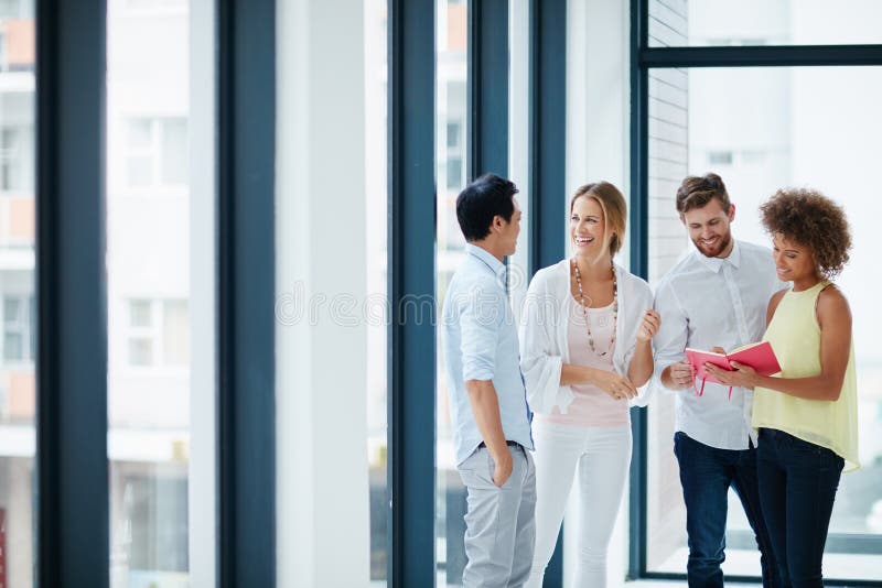 Good Communication is the Heart of a Great Team. Shot of a Group of ...