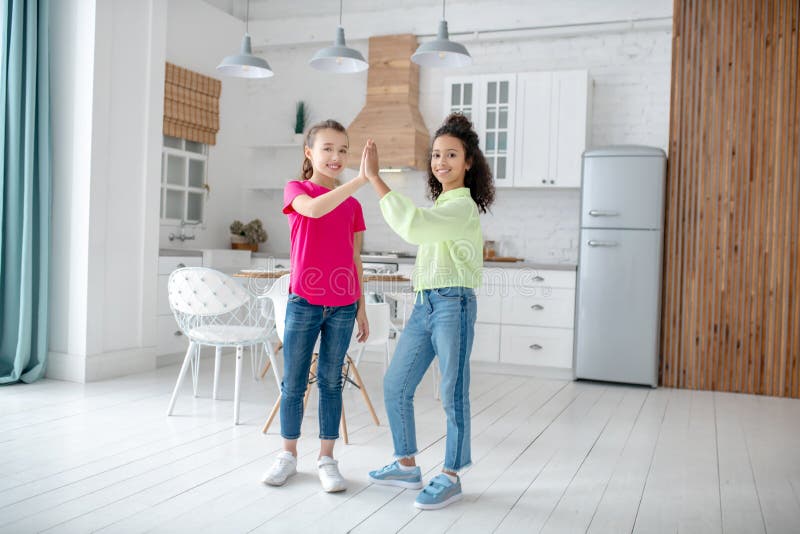 Two Friends Standing in the Kitchen Feeling Good Stock Photo - Image of ...