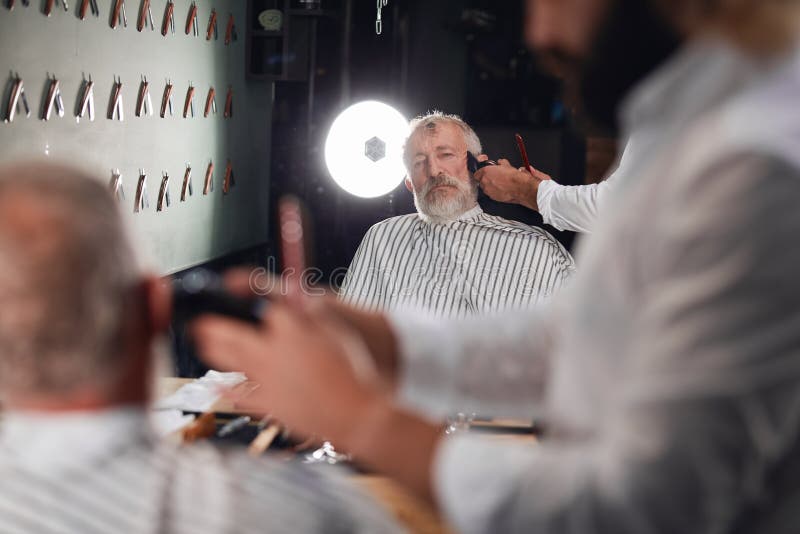 Good Looking Barber Using Shaver at Workplace Stock Image - Image of ...