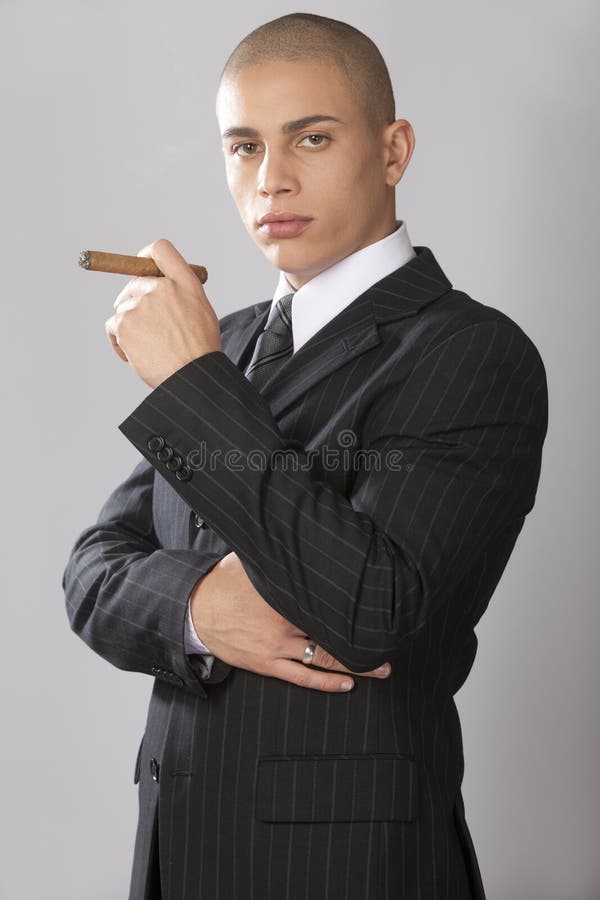 Good Looking Businessman on Gray Stock Image - Image of wealthy, cigar ...