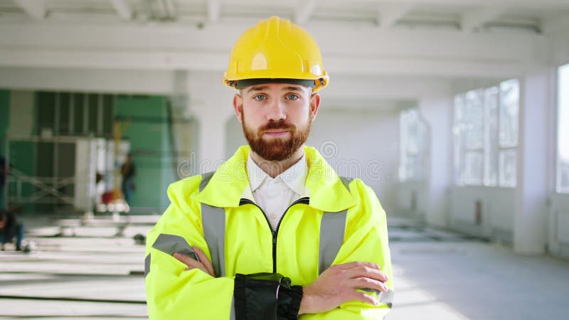 Good Looking Construction Worker Posing in Front of the Camera Crossing ...