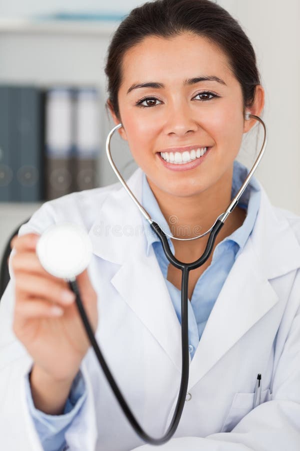 Good Looking Female Doctor Using a Stethoscope Stock Photo - Image of ...