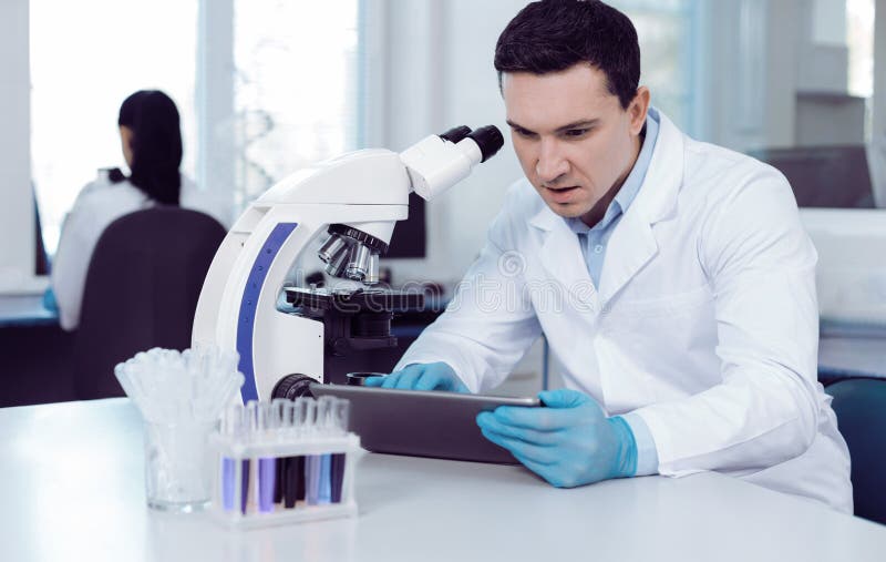 Good Looking Handsome Man Holding a Tablet Stock Image - Image of ...