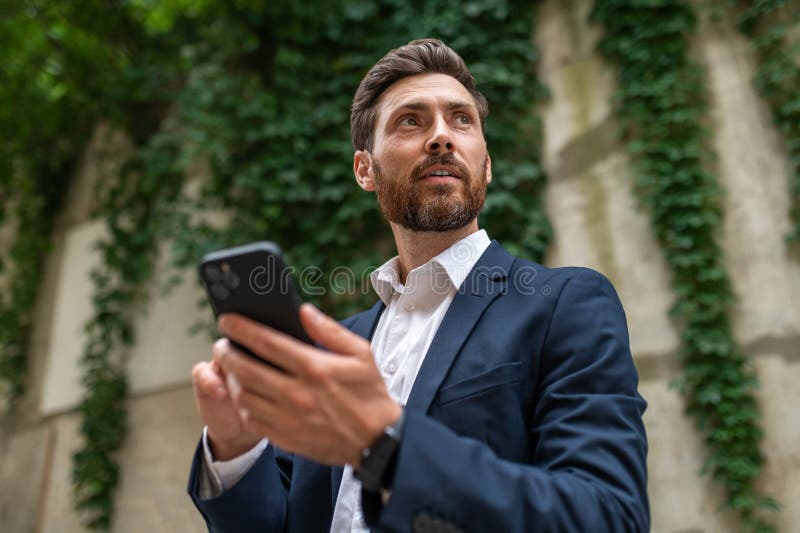 Good-looking Handsome Man with a Phone in Hand Stock Image - Image of ...