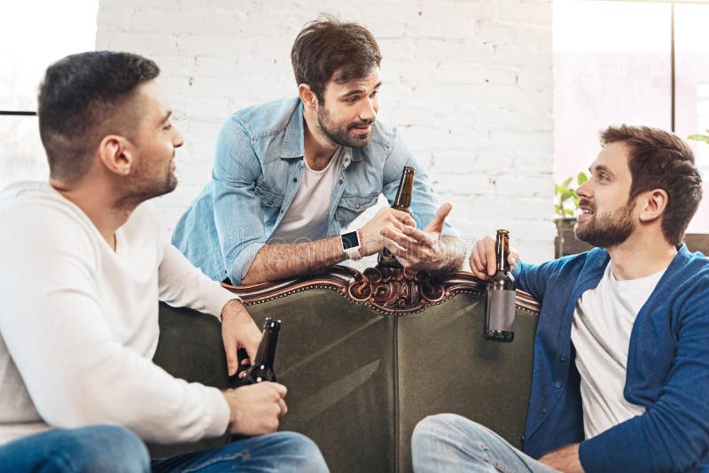 Good Looking Joyful Friends Having a Conversation Stock Photo - Image ...
