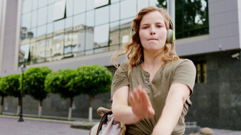 Good Looking Lady in Front of the Camera Dancing and Singing in Front ...