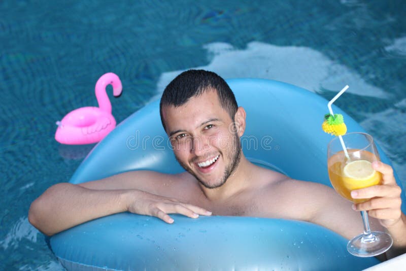 Good Looking Man Drinking Cocktail in Swimming Pool Stock Photo - Image ...