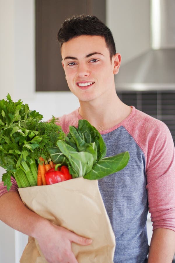 Good Looking Man Holding Bag of Fresh Groceries Stock Image - Image of ...