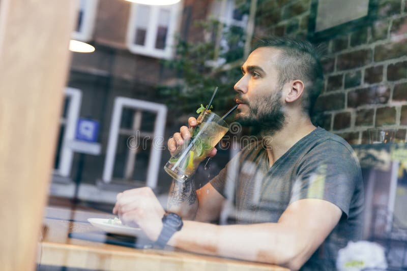 Man Drinking Cold Fit Beverage in a Cafe. Stock Photo - Image of ...
