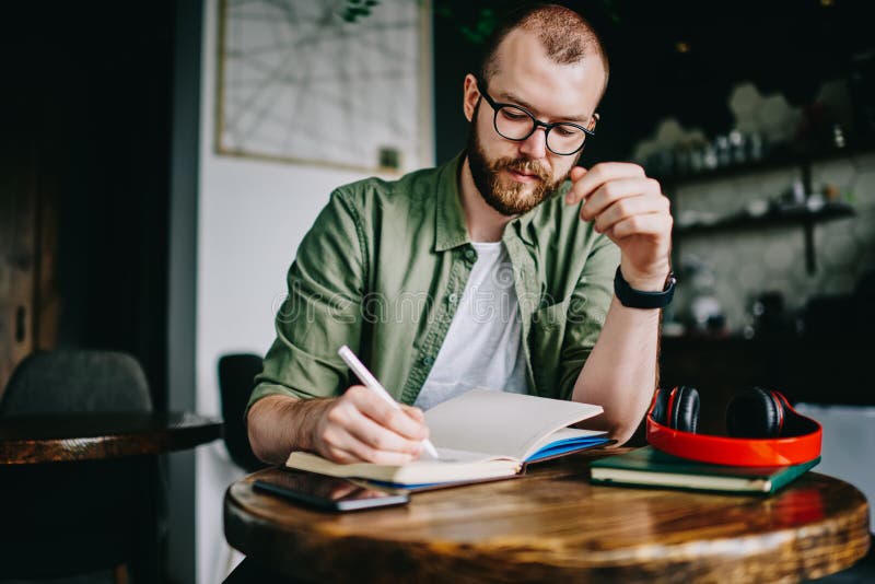 Handsome Creative Author Sitting at Cafe Interior with Notebook Stock ...
