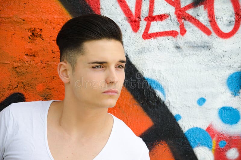 Good Looking Young Man Against Graffiti Wall Stock Photo - Image of ...