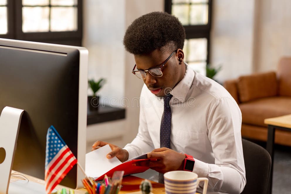 Good Looking Young Man Checking the Documents Stock Photo - Image of ...