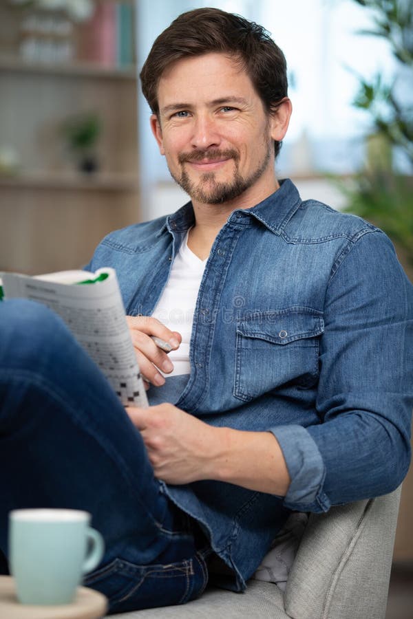 Good Looking Young Man Sitting on Sofa Stock Image - Image of ...