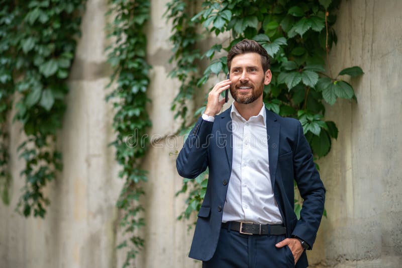 Good-looking Young Man Talking on the Phone and Looking Involved Stock ...