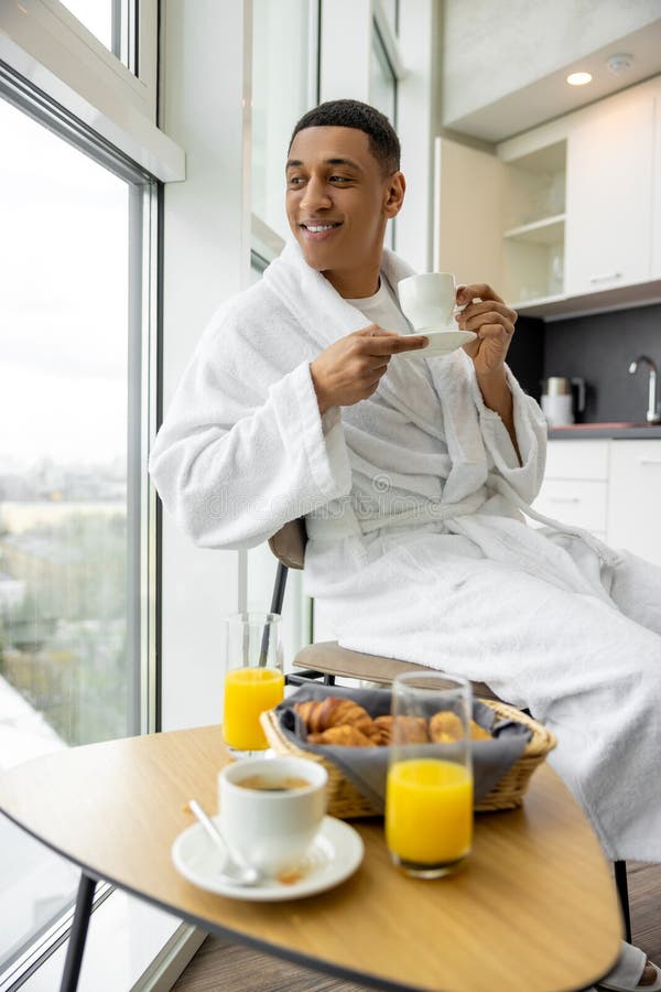 Good-looking Young Man in White Robe Having Healthy Breakfast Stock ...