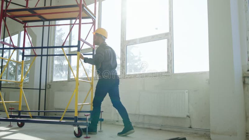 Good Looking Young Multiracial Constructor Worker Take the Mobile ...