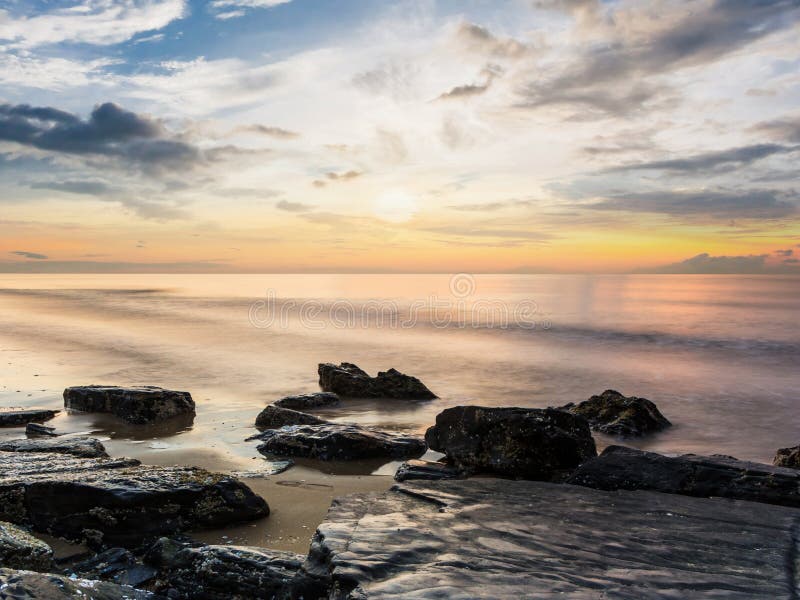 Good morning at rock beach stock image. Image of stone - 83251121