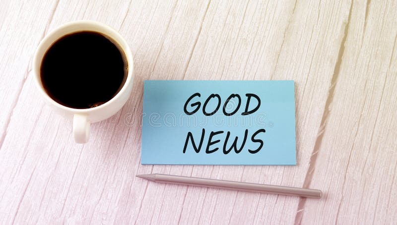 GOOD NEWS Text on the Blue Sticker with Cofee and Pen Stock Image ...